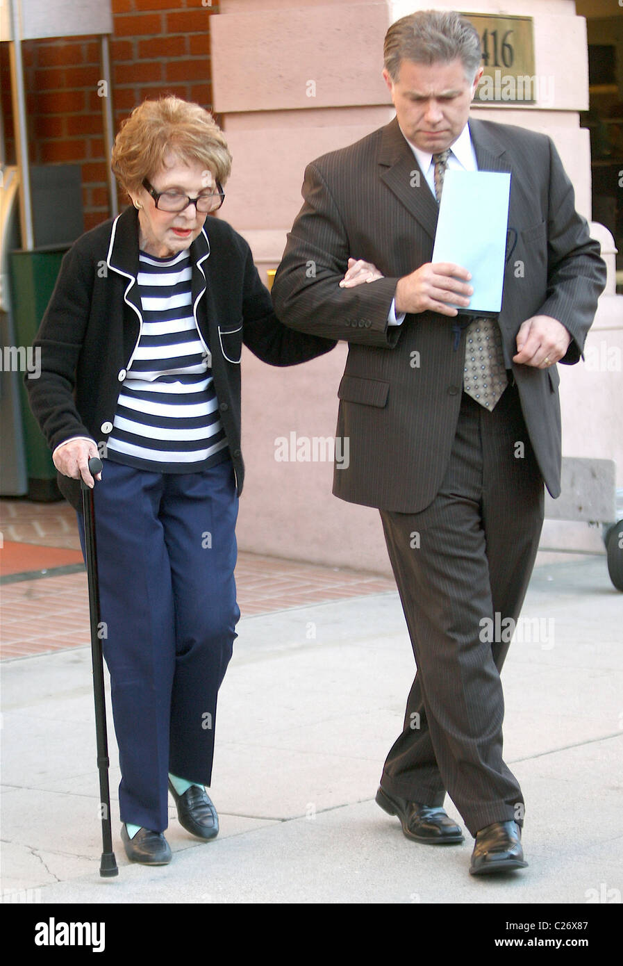 Nancy Reagan with a walking stick leaving a medical building in Beverly ...