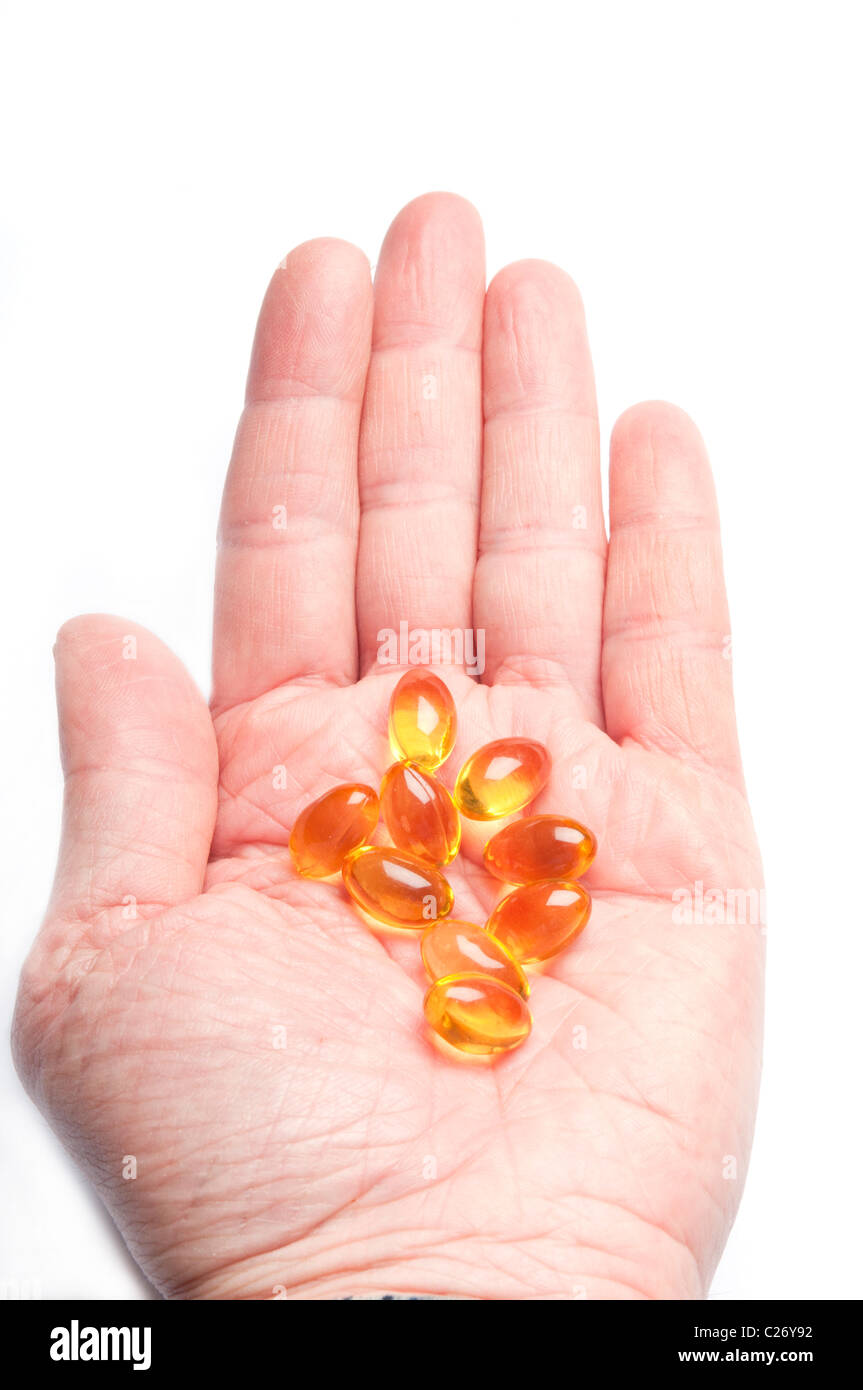 hand holding medicine gel capsules Stock Photo - Alamy