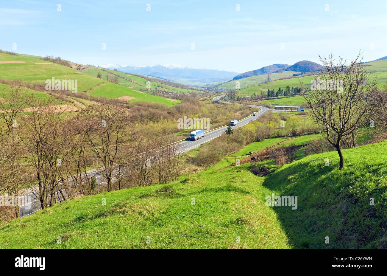 Spring mountain country valley view with farm fields and road Stock ...