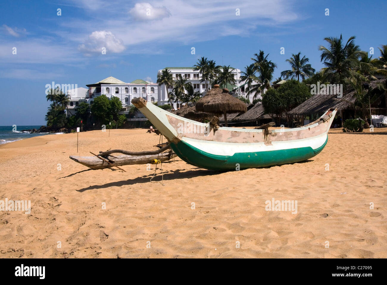 Mount Lavinia Hotel, Sri Lanka from the beach with boats in the ...