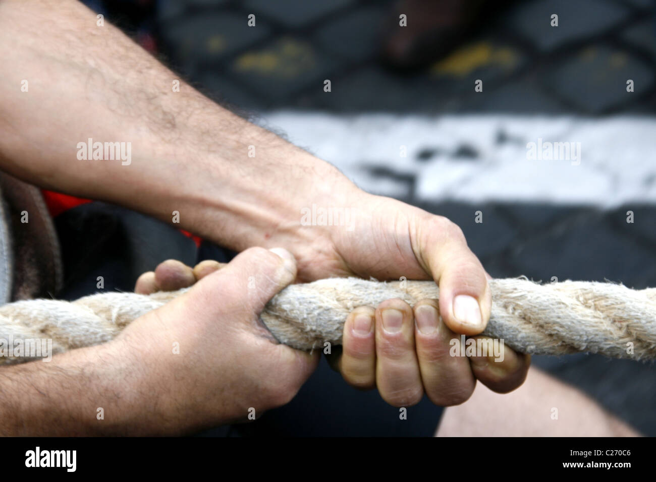 close up detail of man pulling rope in tug of war competition Stock ...