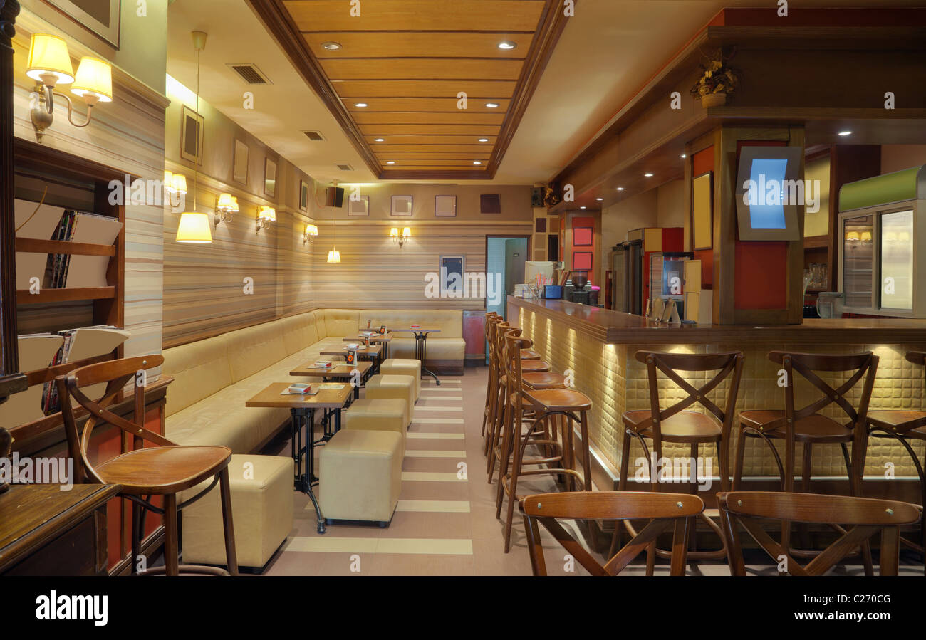Cafe interior with wooden furniture, lighting equipment and decoration ...
