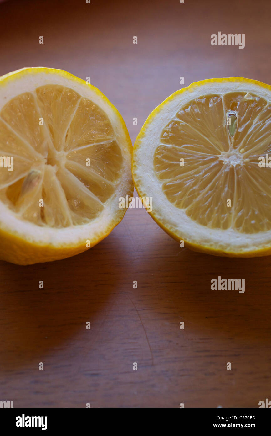 A lemon cut in half Stock Photo - Alamy