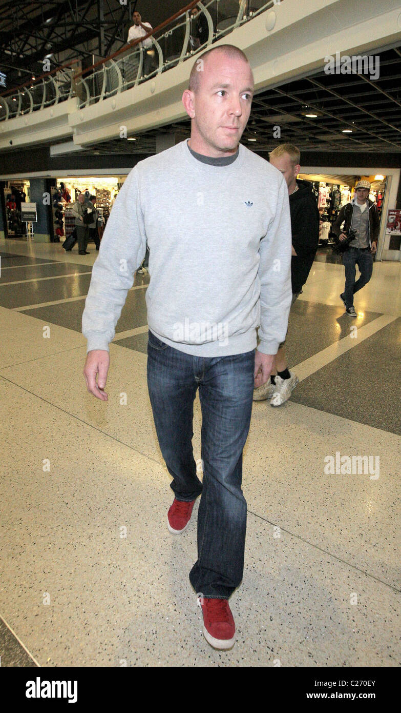 Film director Guy Ritchie arrives at LAX to board a BA flight to London ...