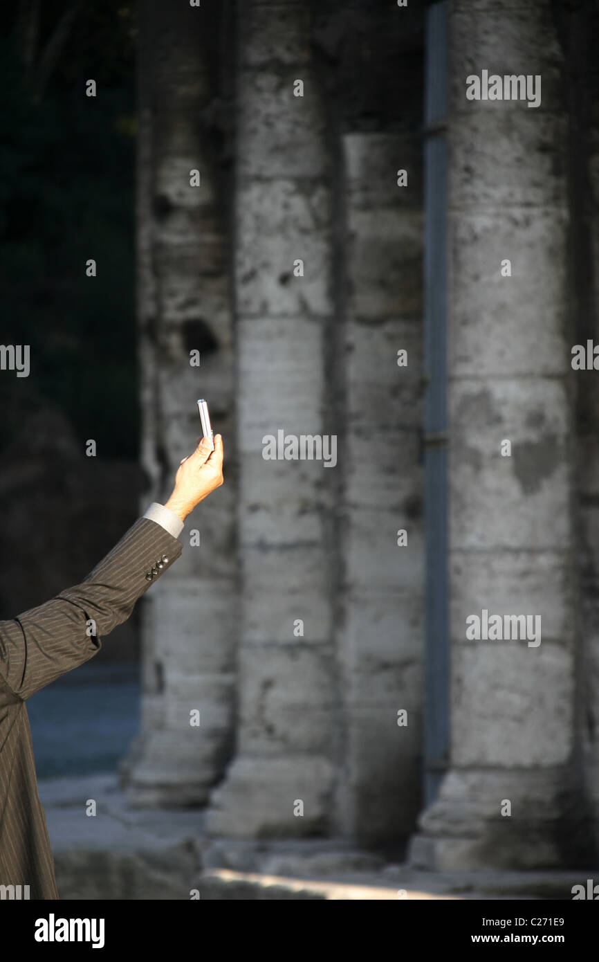 businessman talking photograph of columns in rome italy Stock Photo - Alamy