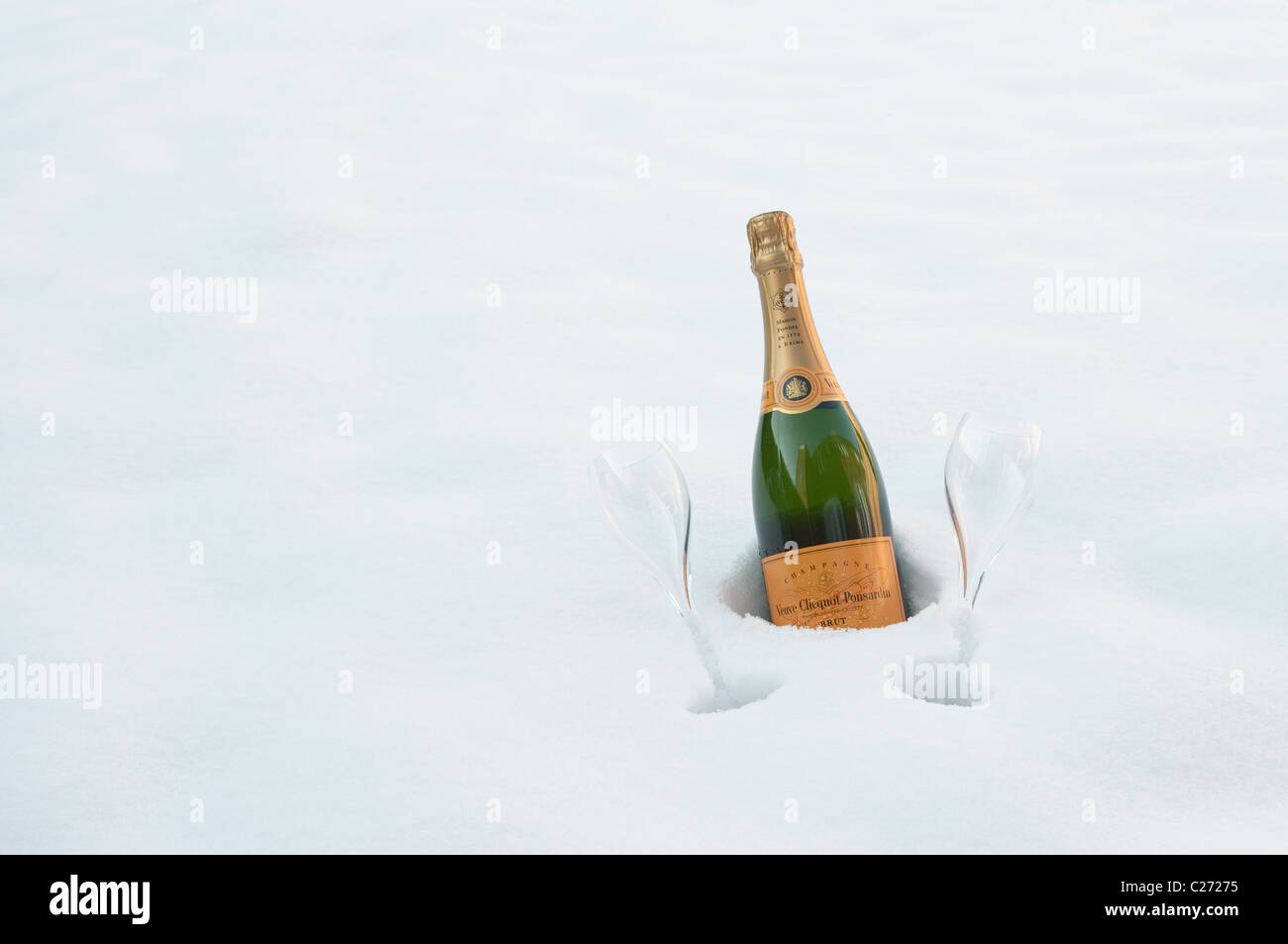 Bottle of Champagne in Snow with Two Glasses (right of frame version ...