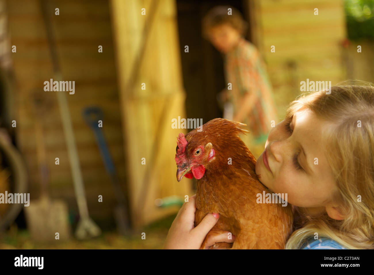 Girl hugging hen High Resolution Stock Photography and Images - Alamy