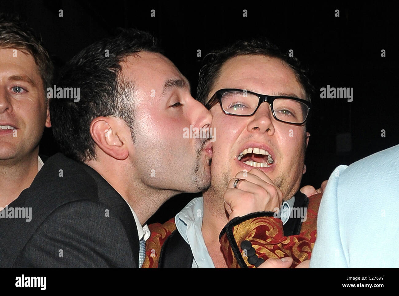 Alan Carr is kissed by a male fan as he leaves Jalouse Club after ...