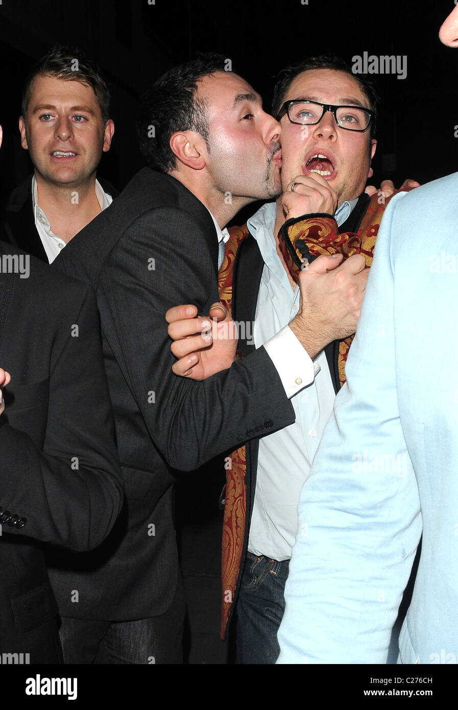 Alan Carr is kissed by a male fan as he leaves Jalouse Club after ...