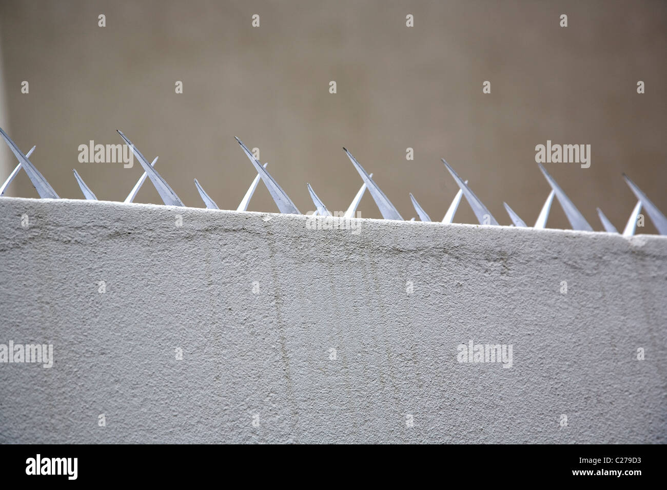 Spikes on wall Stock Photo - Alamy
