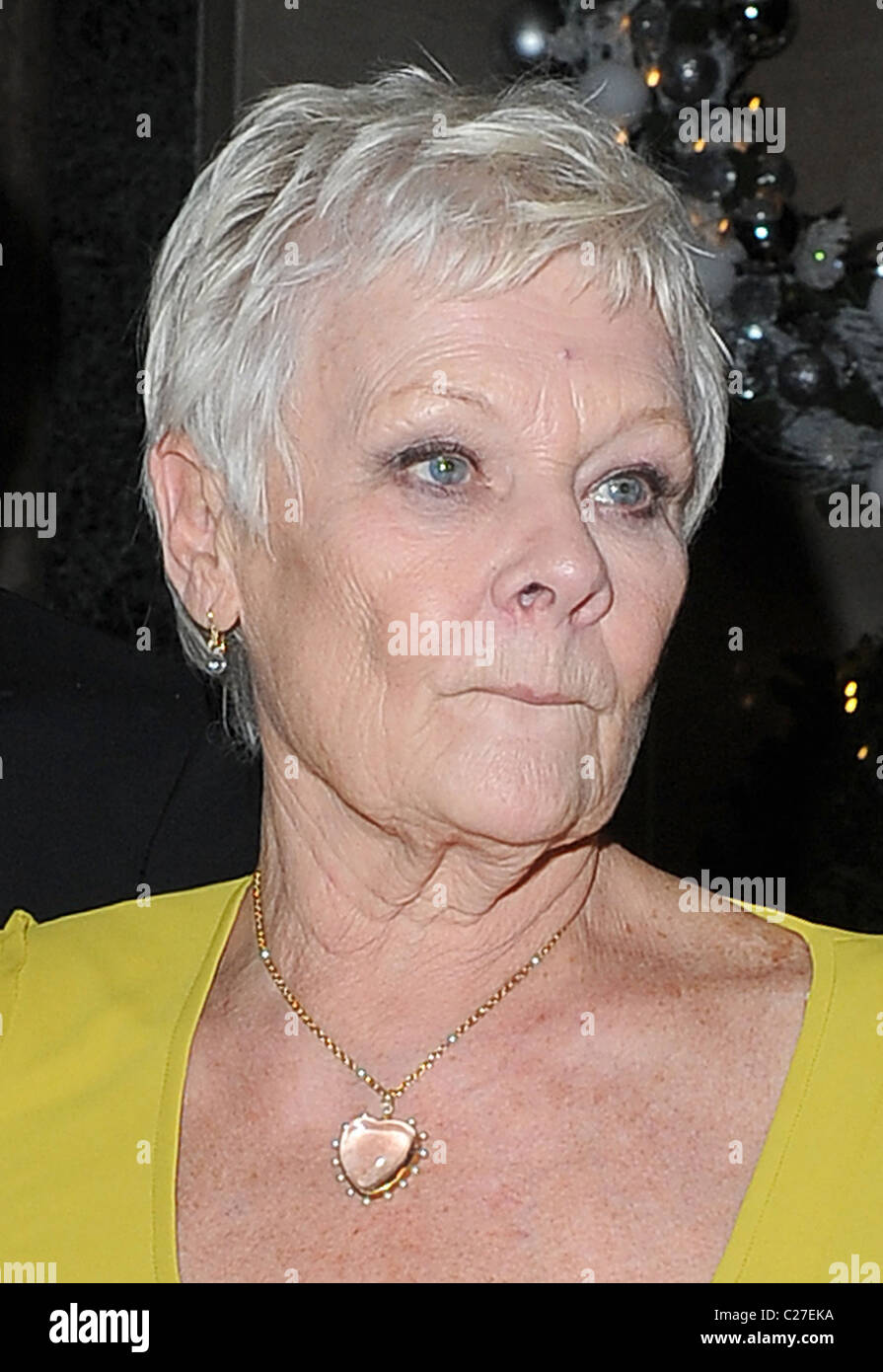 Dame Judi Dench leaving Claridges Hotel with a younger male companion ...