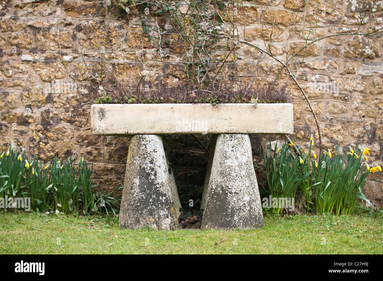 The Pi symbol, made of stone, functioning as a flower bed in a garden ...