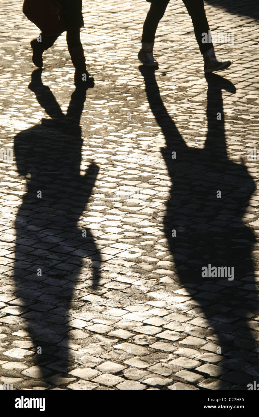 person walking in street road in city town Stock Photo - Alamy