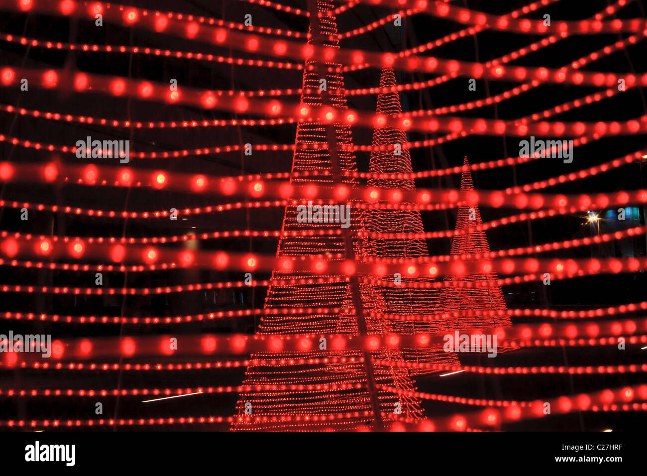 Christmas trees made of red lights in the city Stock Photo - Alamy