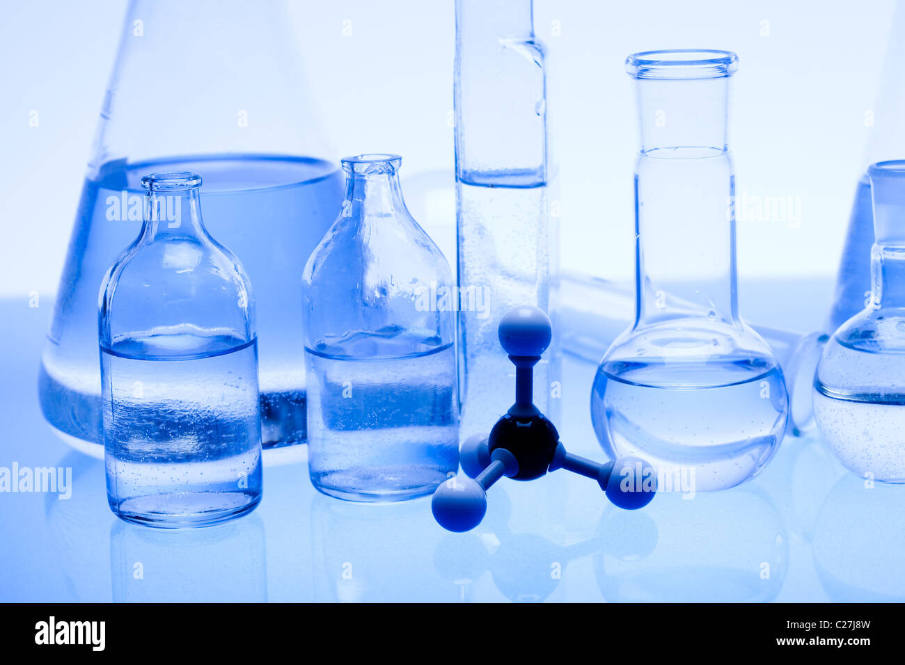 Laboratory glass in blue scenery Stock Photo - Alamy