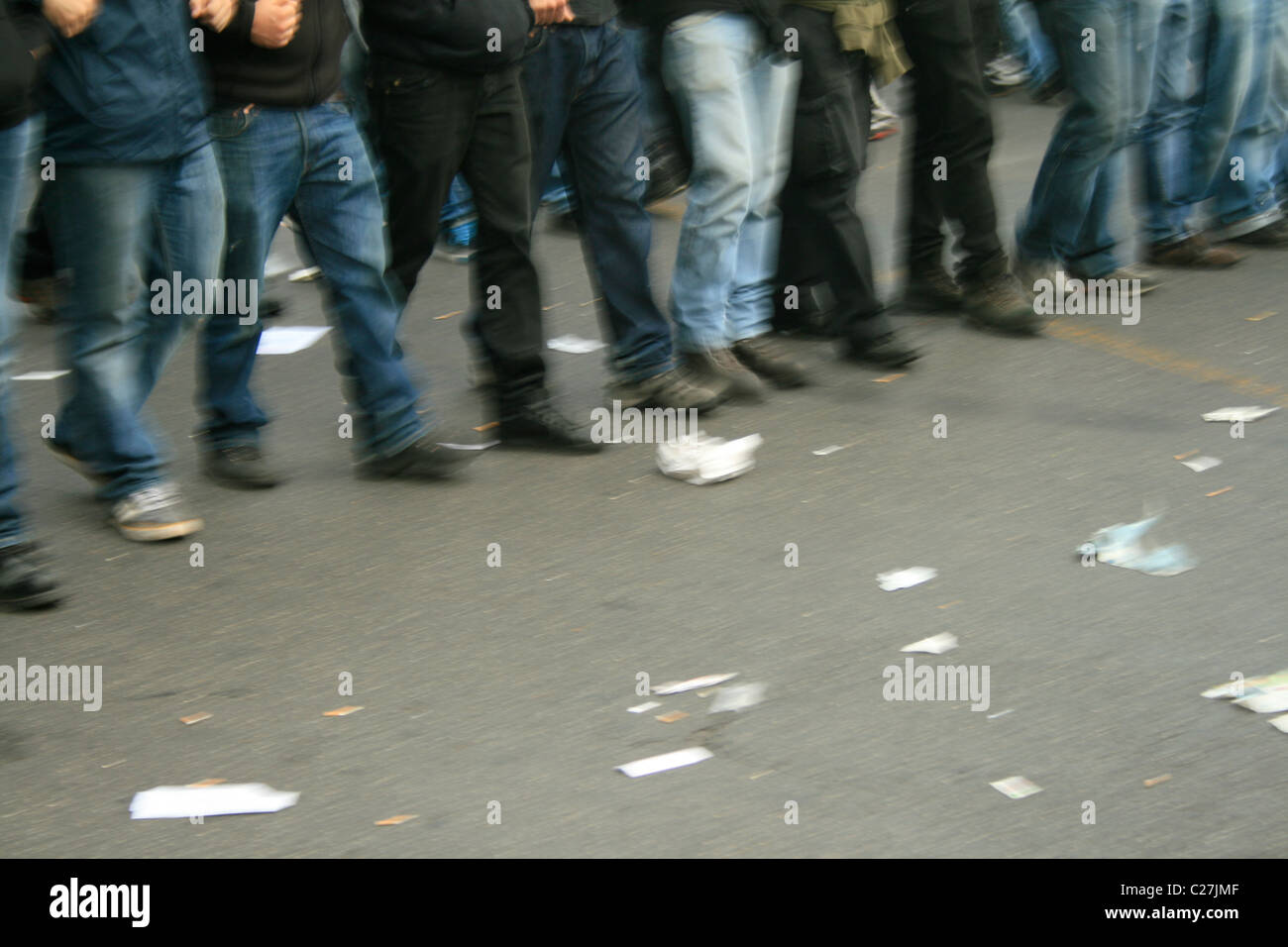 group of teenagers protesters walking in a line at protest demo rally ...