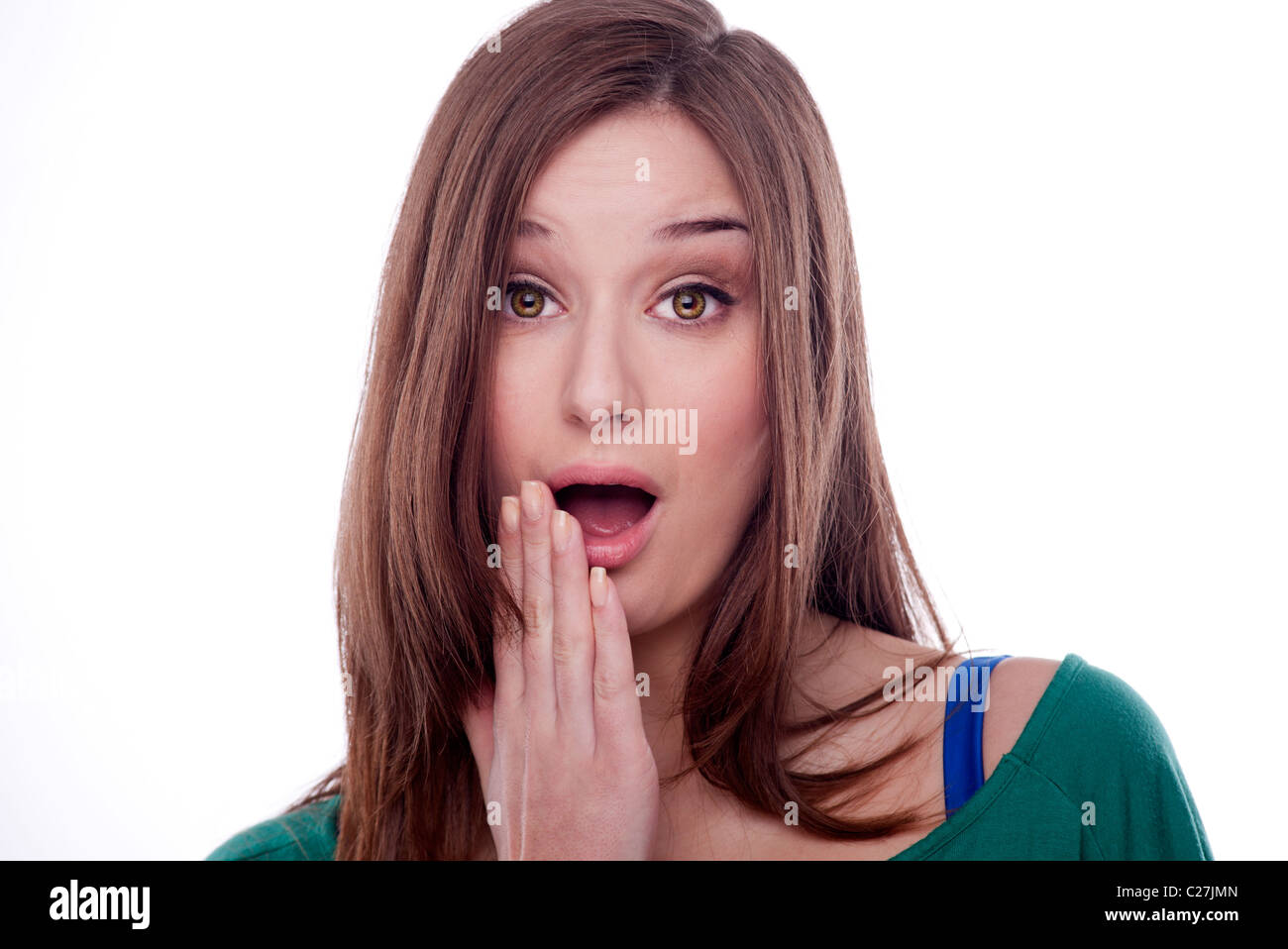 Brunette woman looking shocked by what she has seen or heard Stock ...