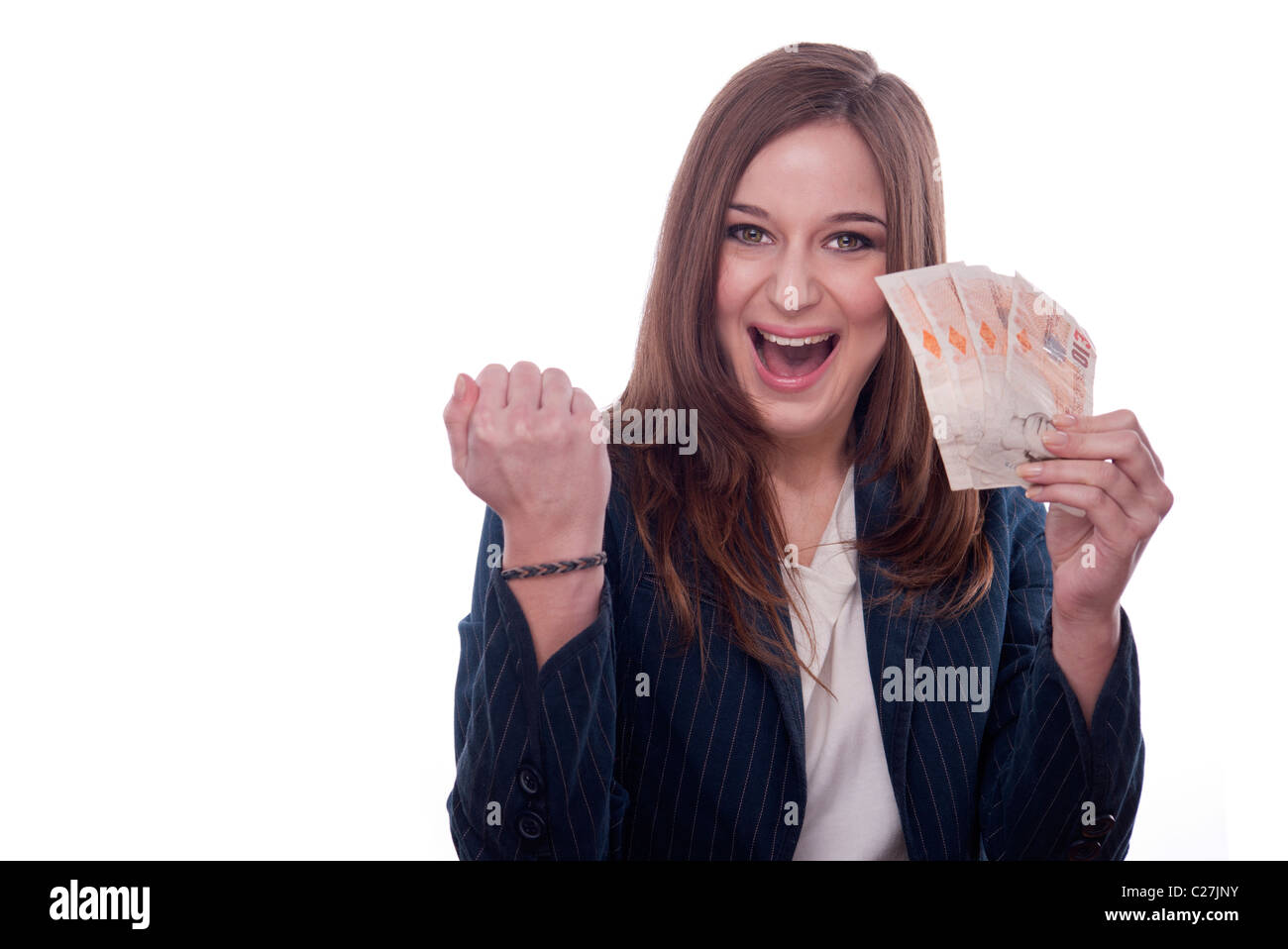 Brunette woman holding a hand full of ten pound bank notes , spending ...