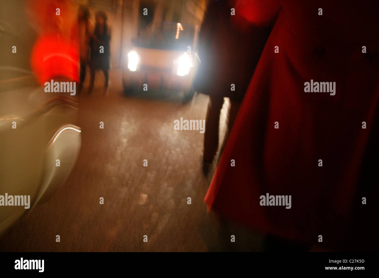 pedestrians walking in city street at night Stock Photo - Alamy