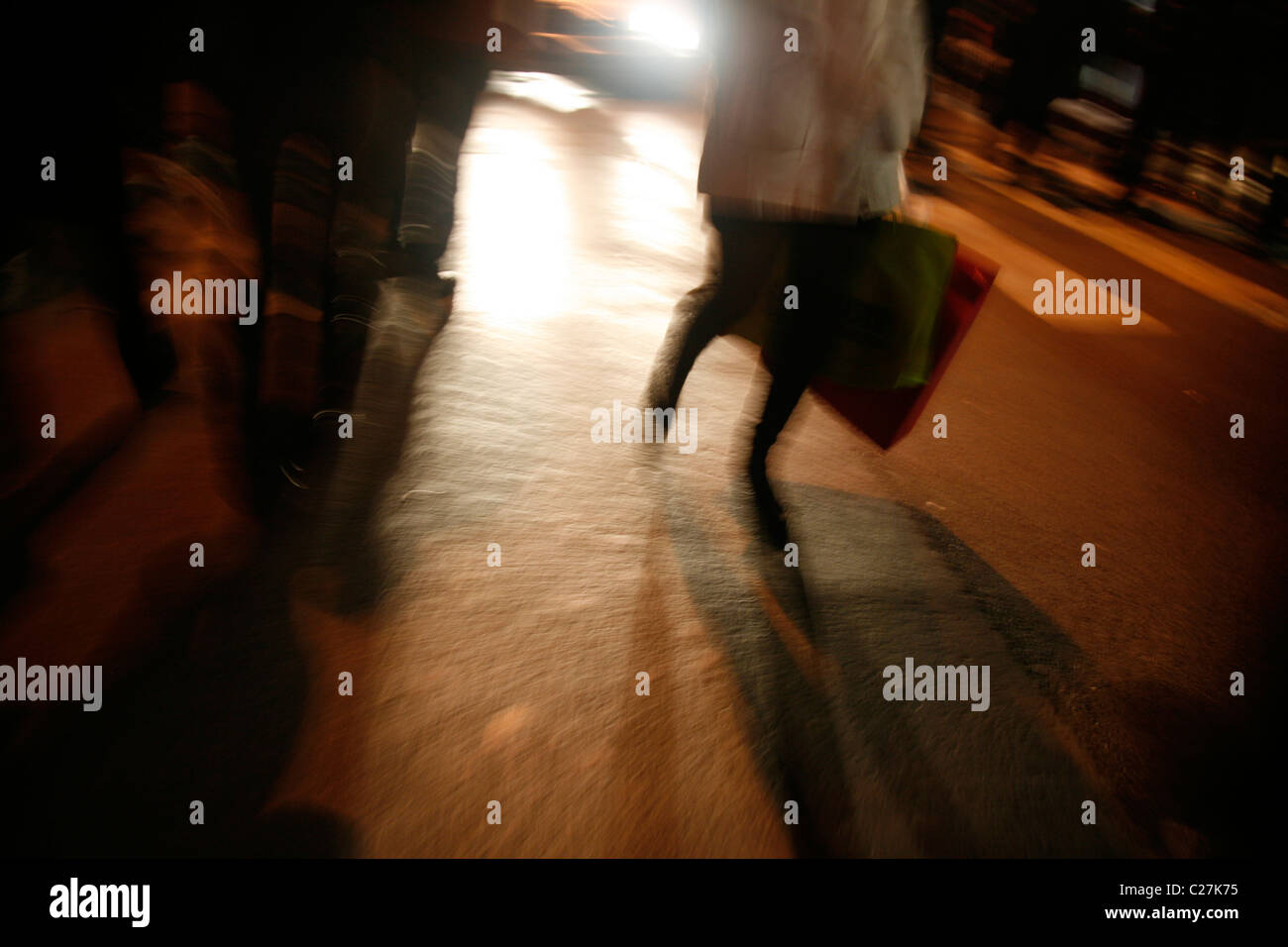 pedestrians walking in city street at night Stock Photo - Alamy