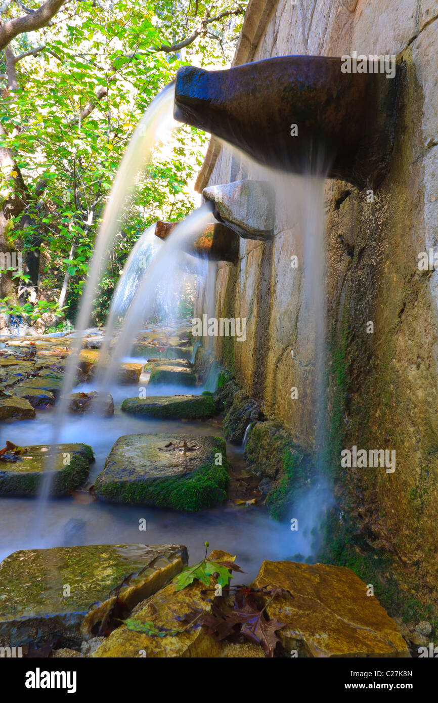 Water spring in Ancient park in Greece Stock Photo - Alamy