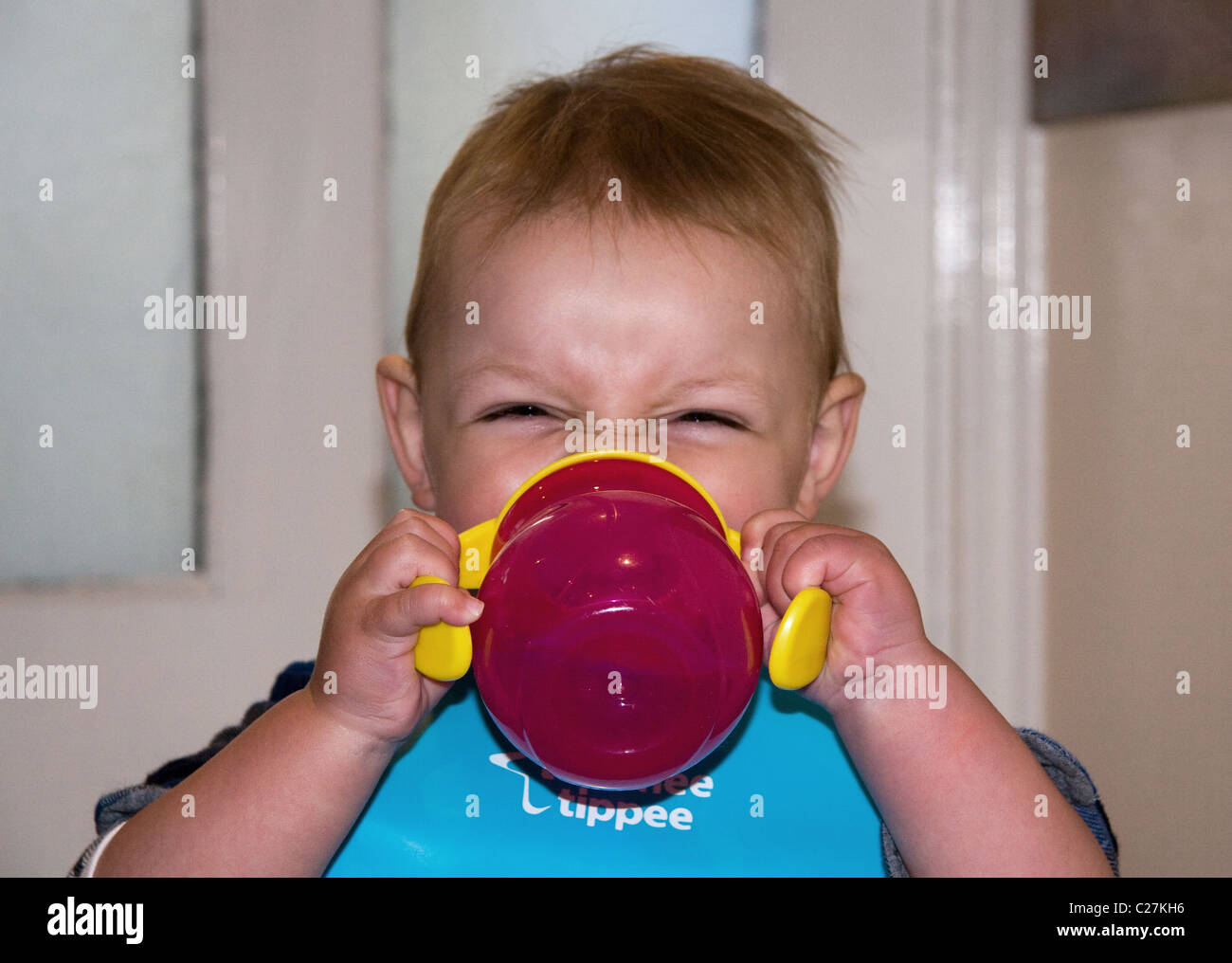 Young boy drinking from beaker hi-res stock photography and images - Alamy