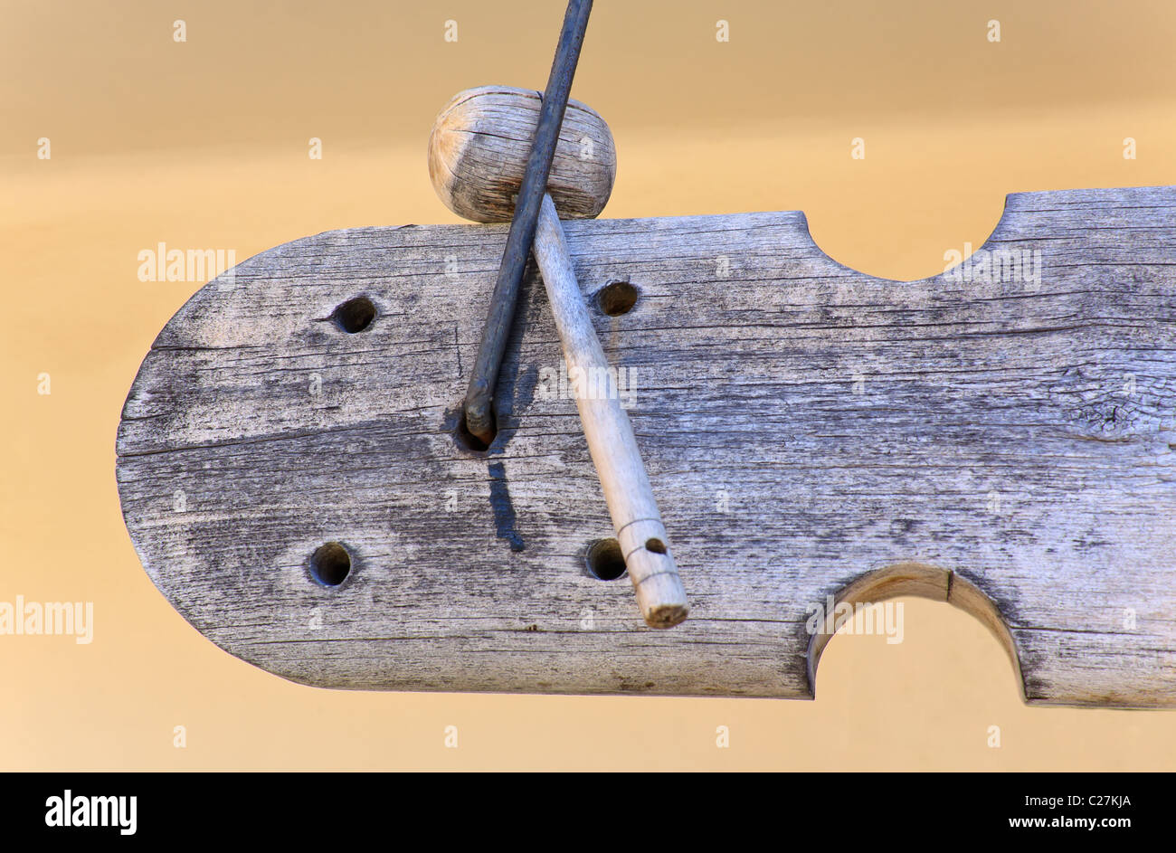 Pluck of wood and hammer used as prayer bell in monastery in Greece ...