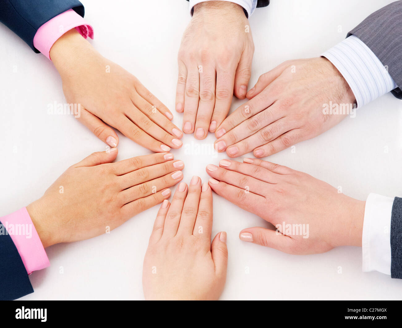 Above view of business partners making circle from hands on table Stock ...