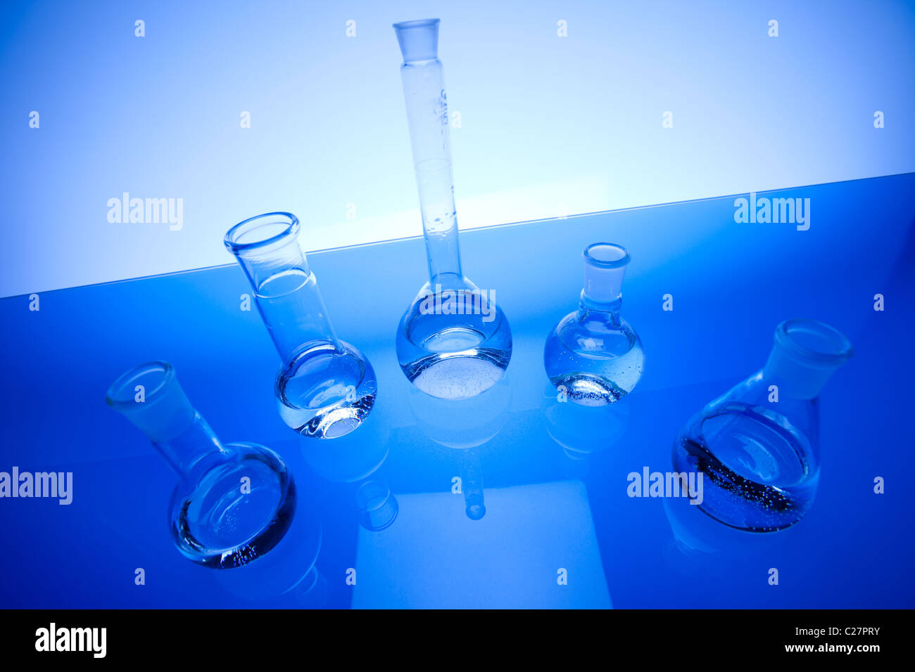 Laboratory glass in blue scenery Stock Photo - Alamy