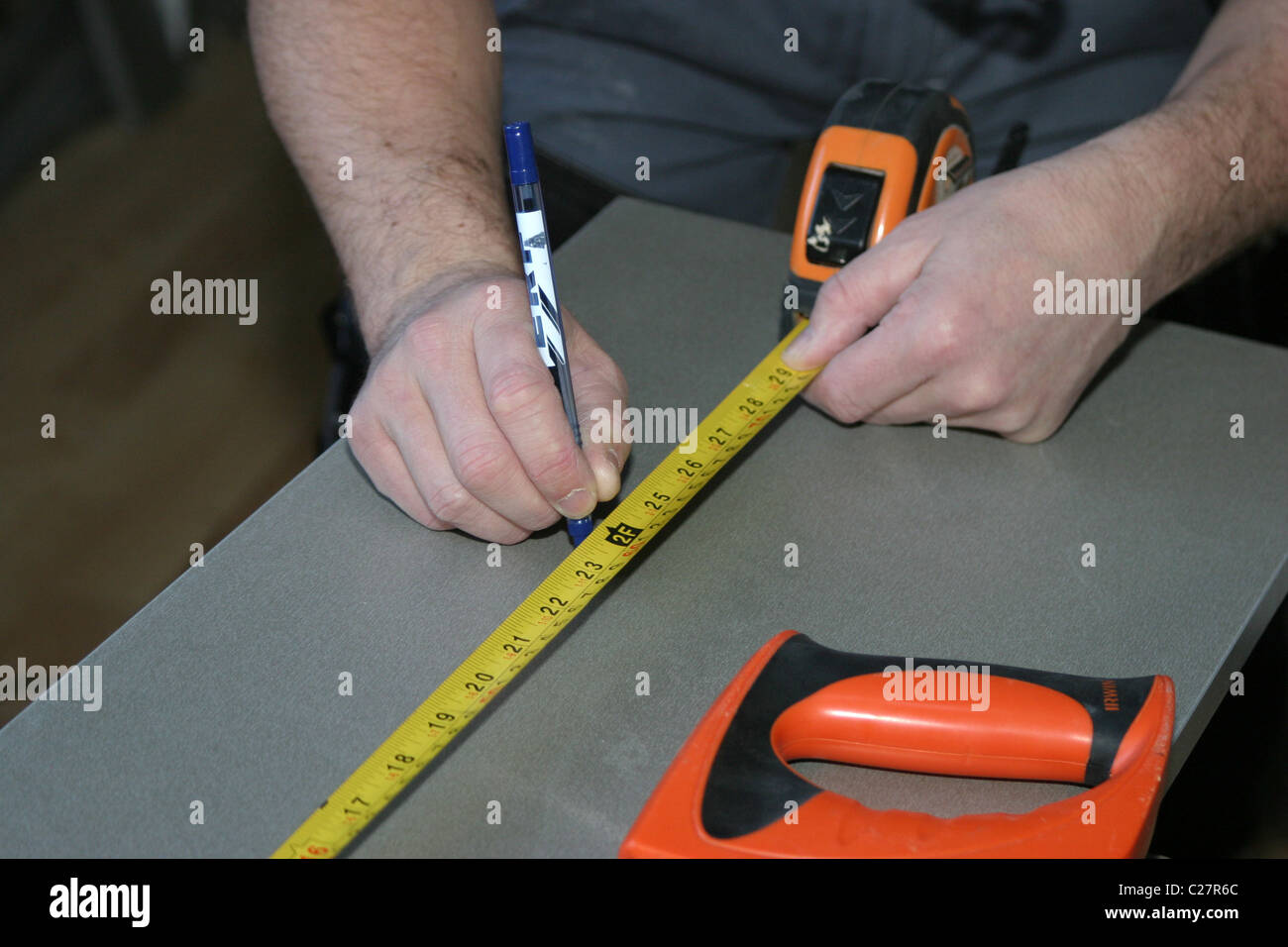 diy measuring using a tape measure Stock Photo - Alamy