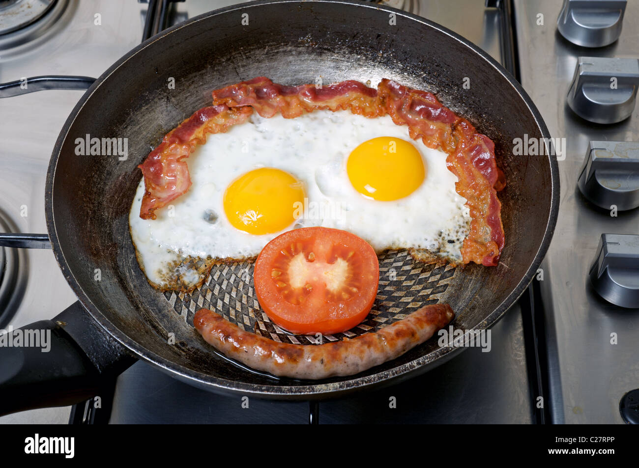 Fried breakfast in the shape of a human face Stock Photo - Alamy