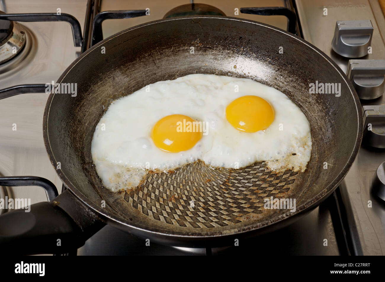 Fried organic egg cooking in frying pan Stock Photo - Alamy Fried organic egg cooking in frying pan Stock Photo - Alamy