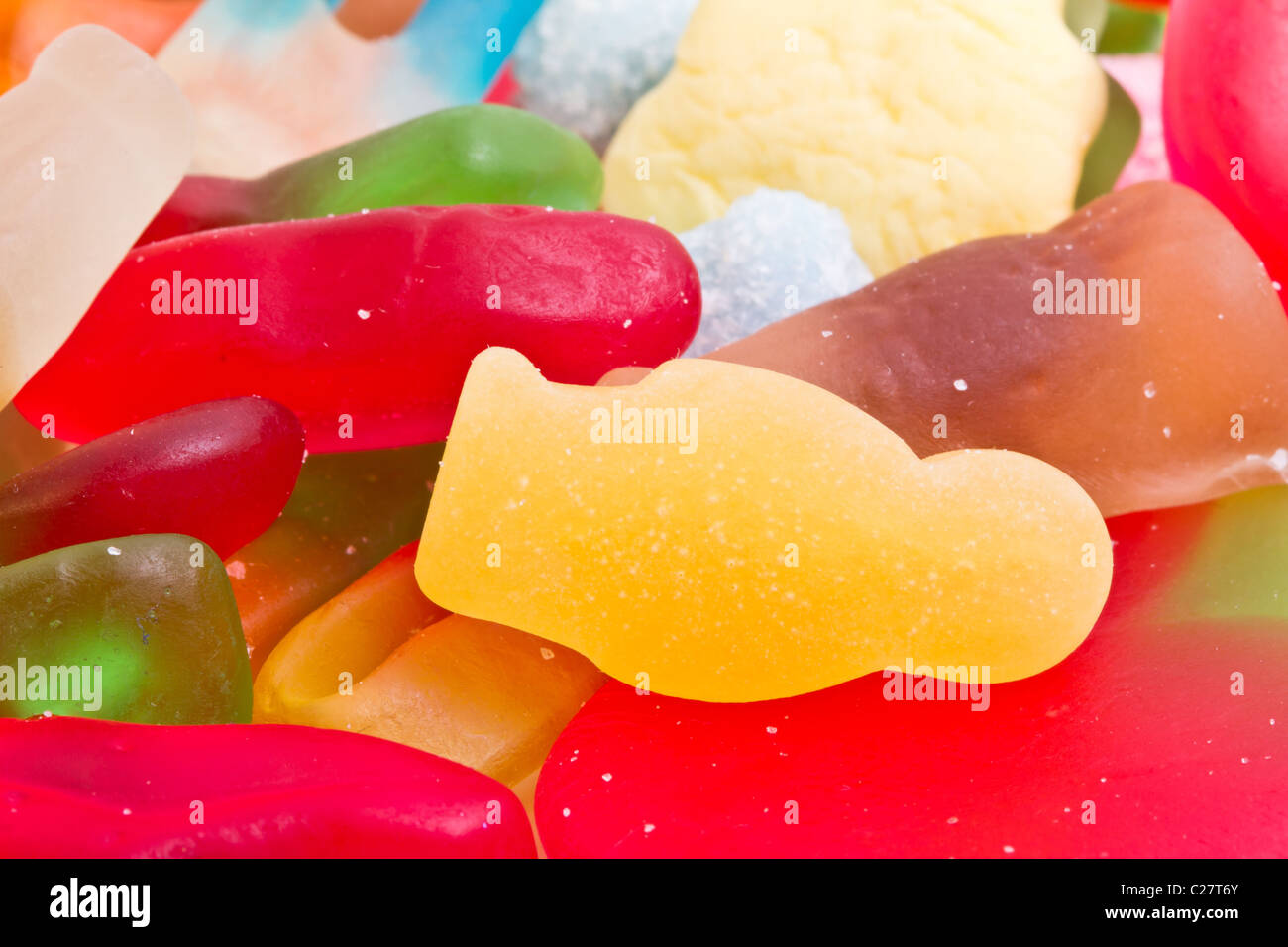 Kids vibrant multicoloured jelly sweet mix up background Stock Photo ...