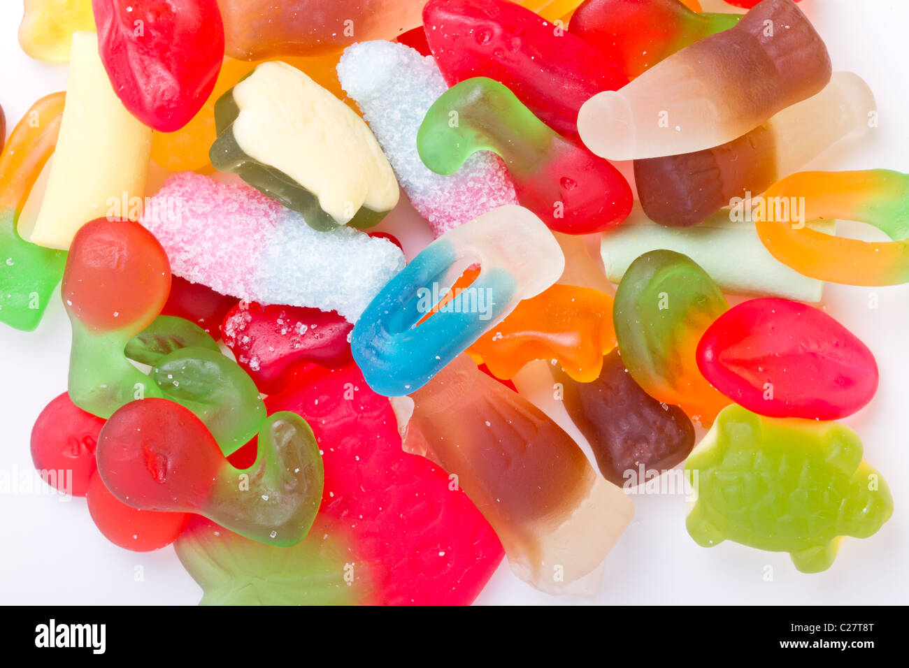 Kids vibrant multicoloured jelly sweet mix up background Stock Photo ...