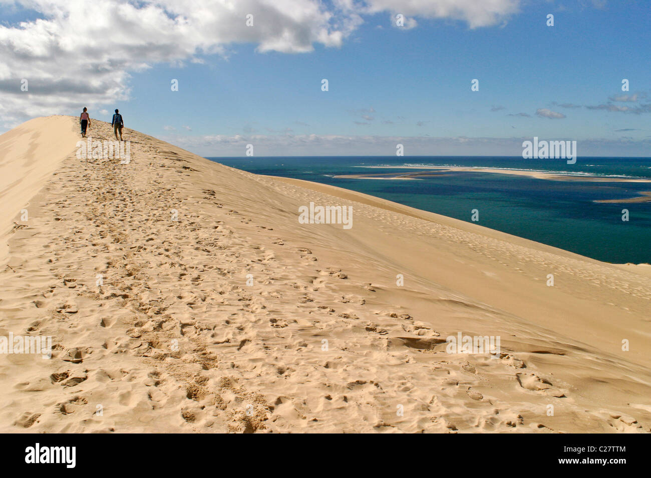 two people walking on the dune du pilat arcachon France.copy space ...