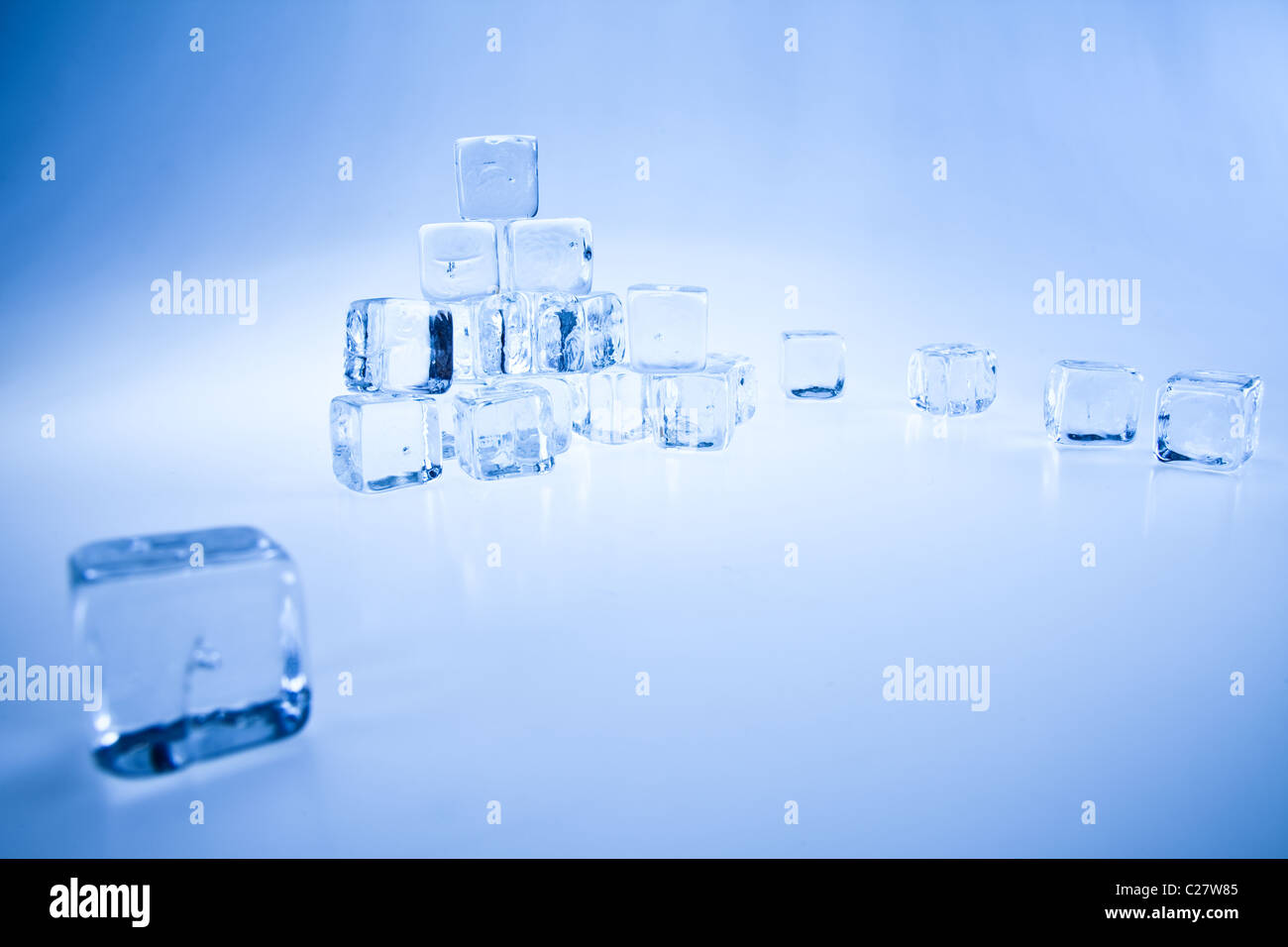 Frozen ice cubes over background Stock Photo - Alamy
