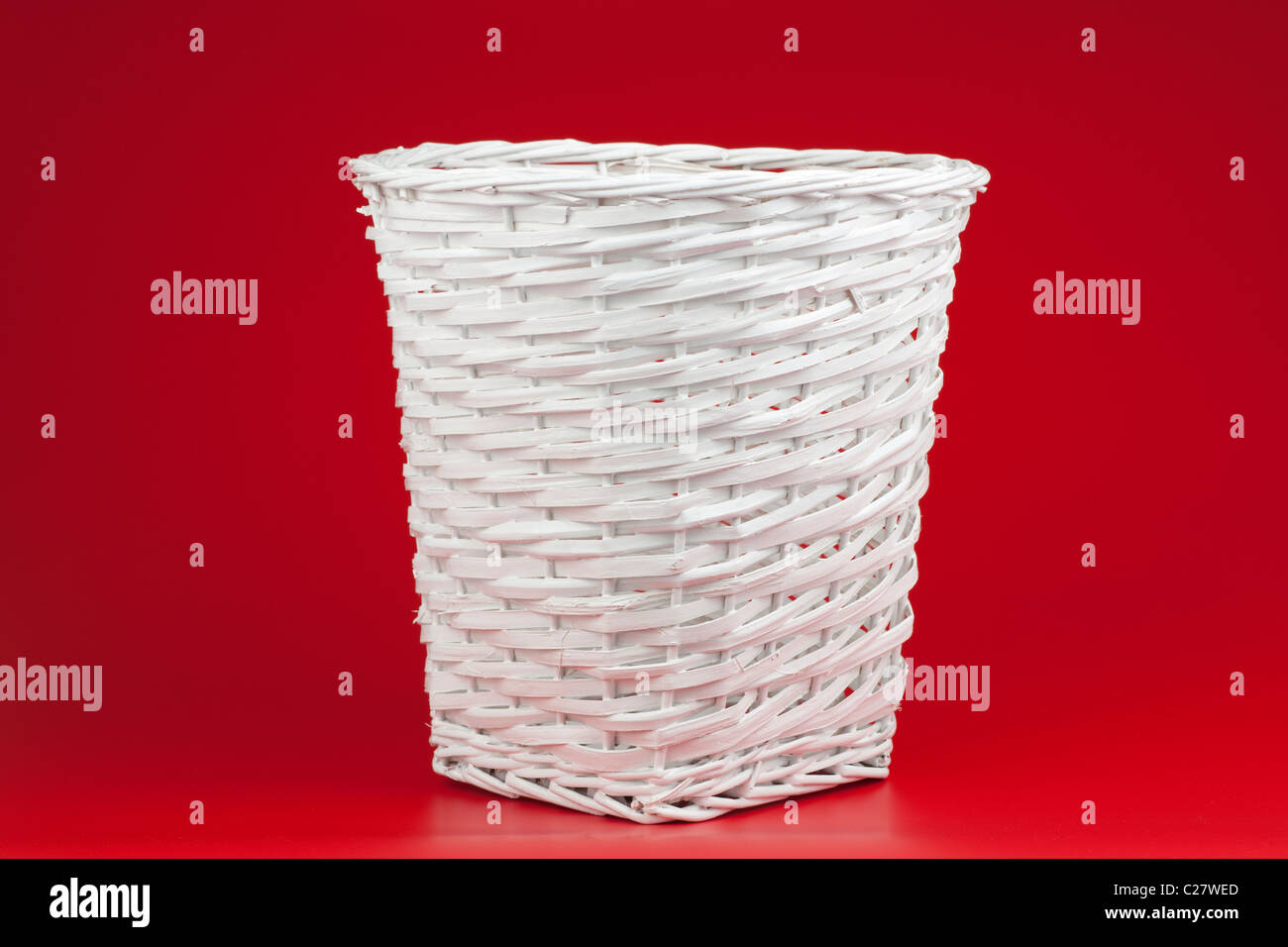 White painted wicker waste paper basket Stock Photo - Alamy