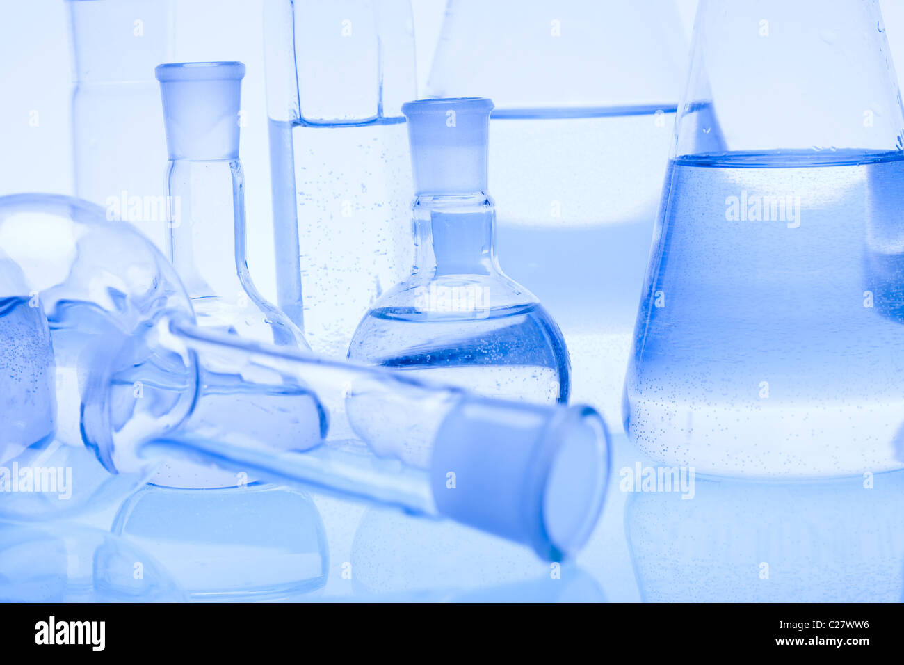 Laboratory glass in blue scenery Stock Photo - Alamy