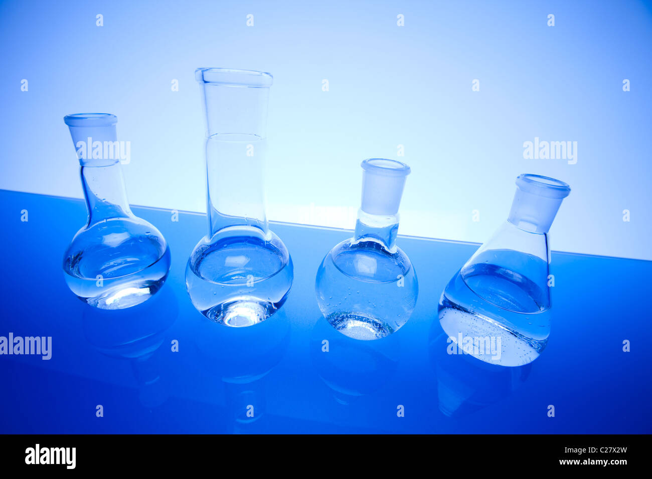 Laboratory glass in blue scenery Stock Photo - Alamy
