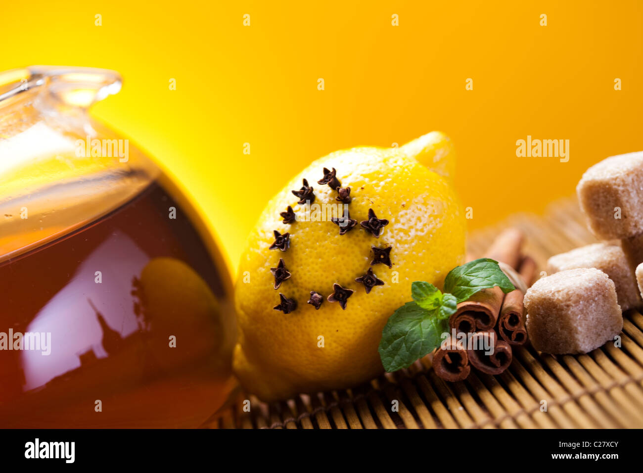 Hot tea over yellow background Stock Photo - Alamy