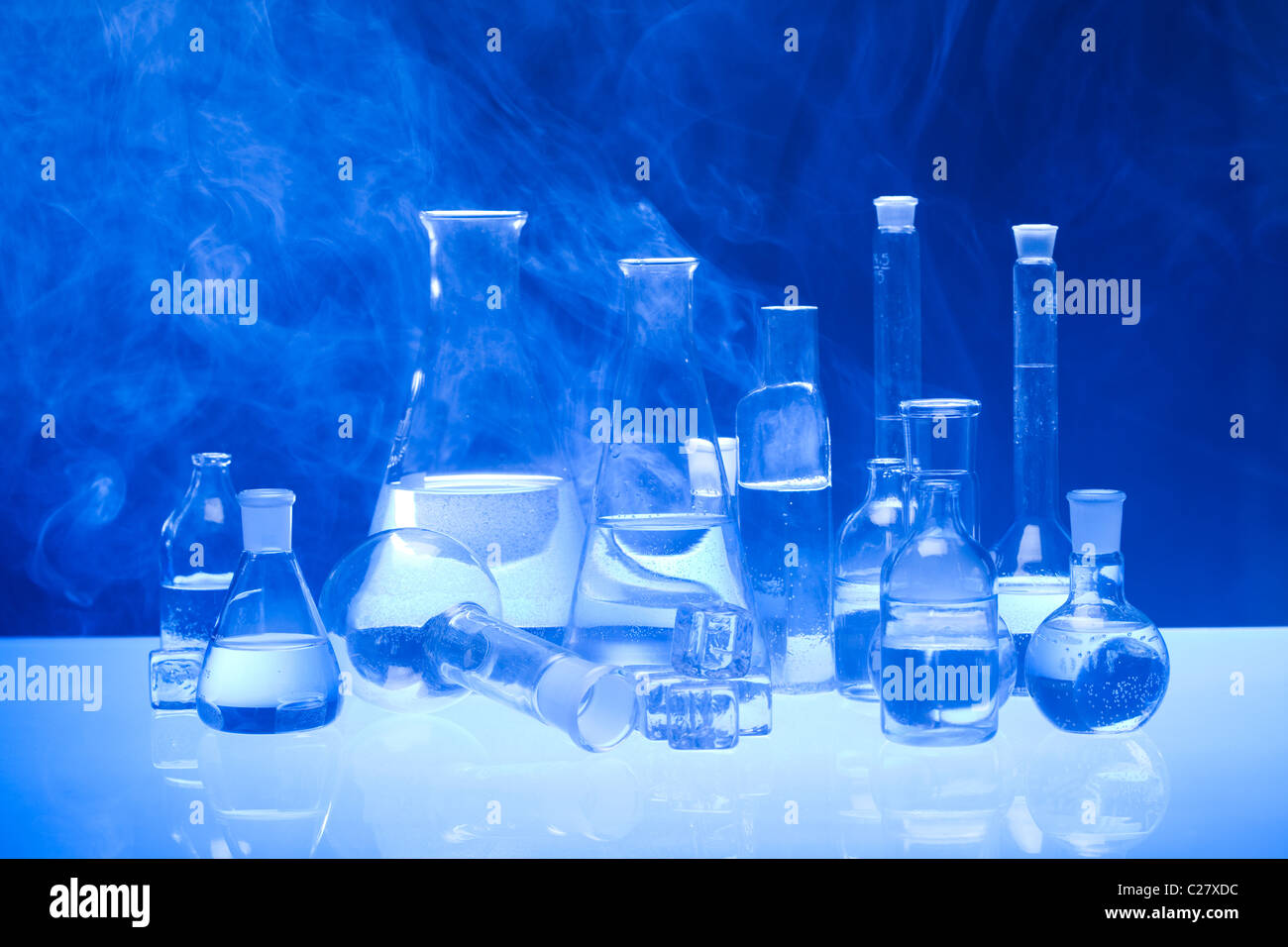 Laboratory glass in blue scenery Stock Photo - Alamy