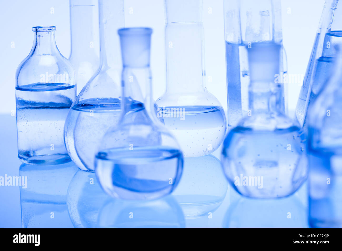 Laboratory glass in blue scenery Stock Photo - Alamy