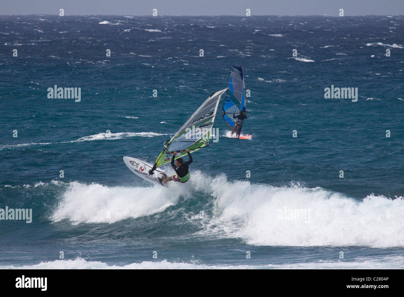 Popping a Wheelie. Windsurfing on Mauis famous Hookipa Beach, located ...