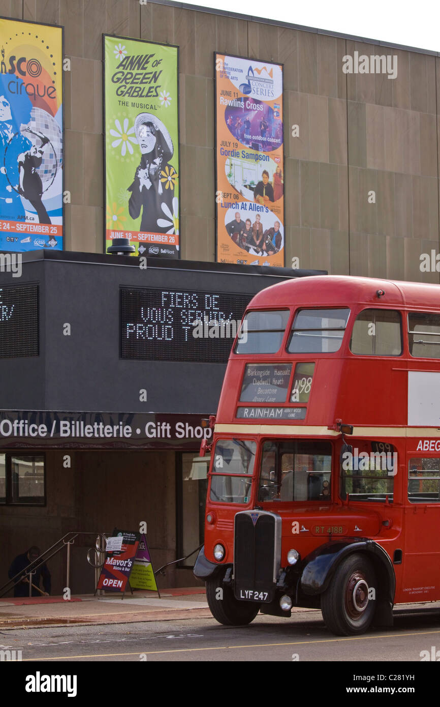 Red double decker bus in front of theatre showing Anne of Green Gables ...