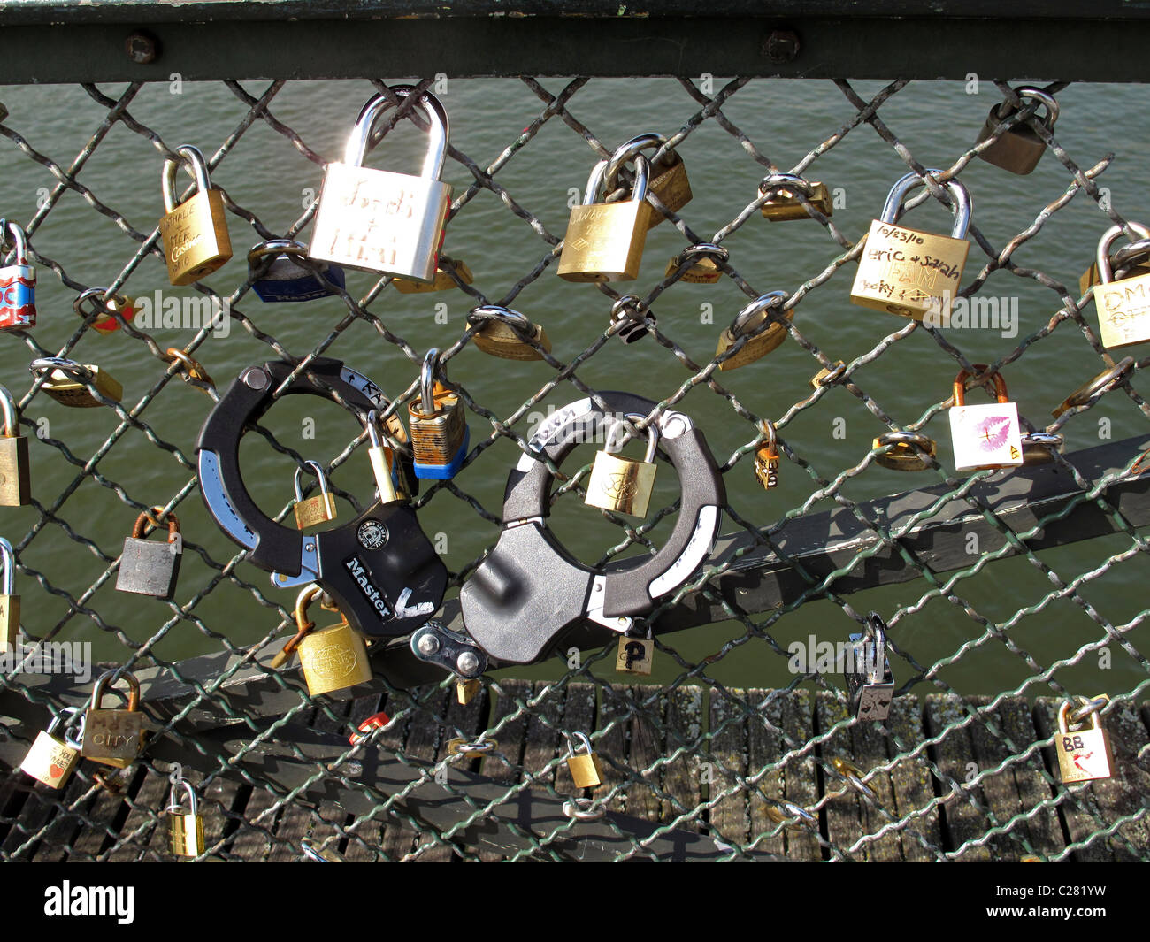 Handcuffs Love padlock on Pont des Arts footbridge on the Seine river ...