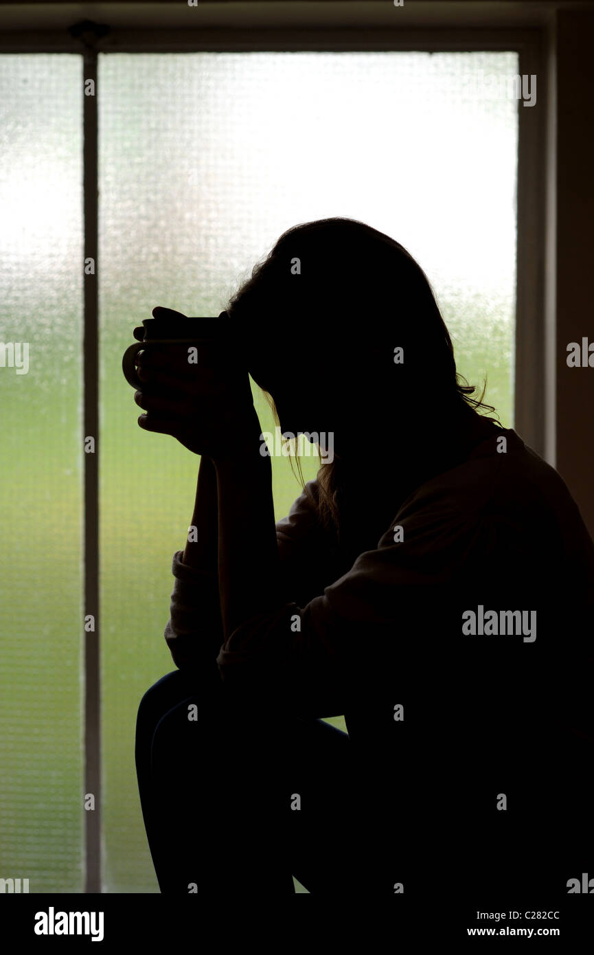Crying woman silhouette hi-res stock photography and images - Alamy