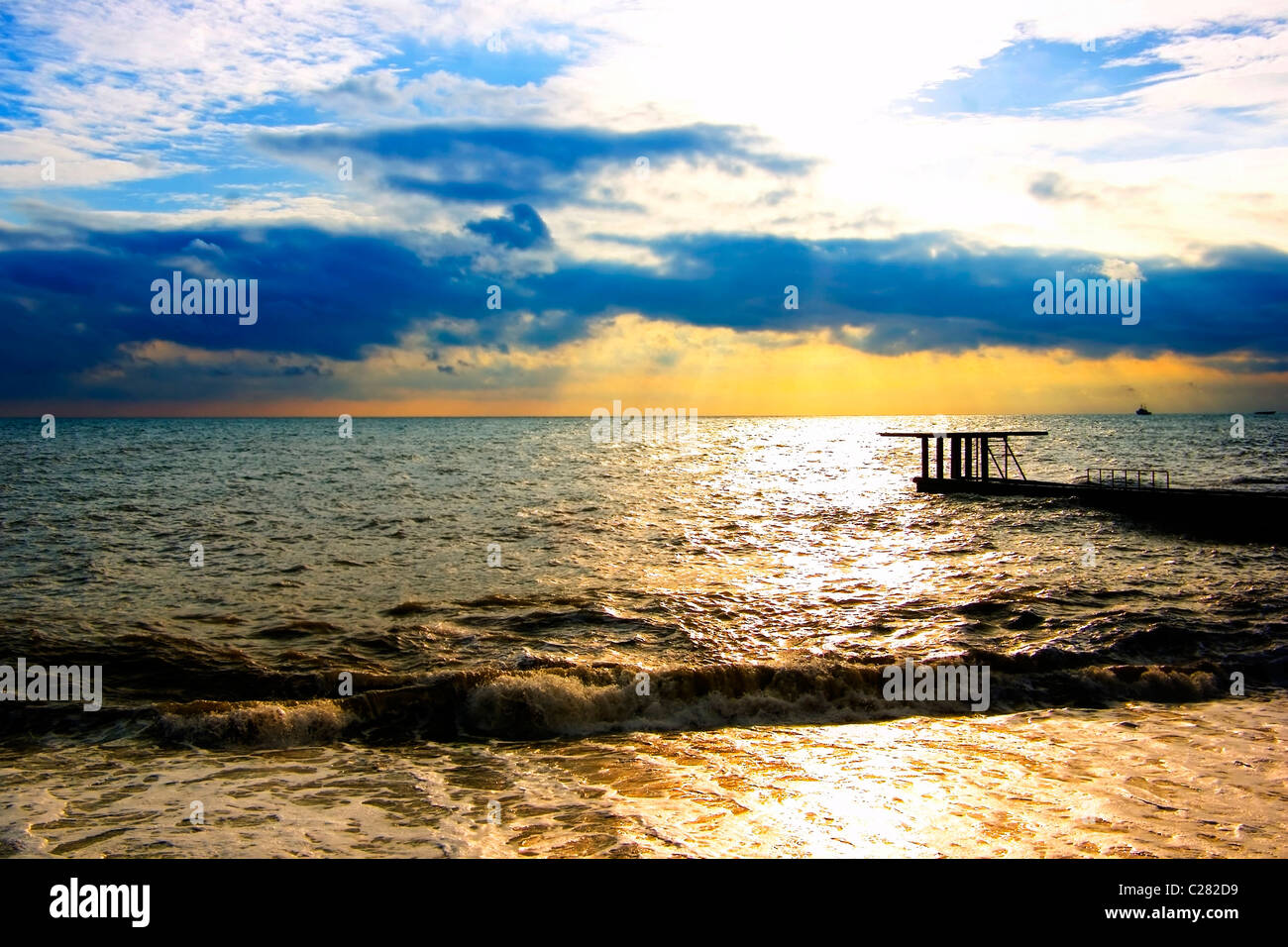 evening landscape of the sea from the pier and ship Stock Photo - Alamy