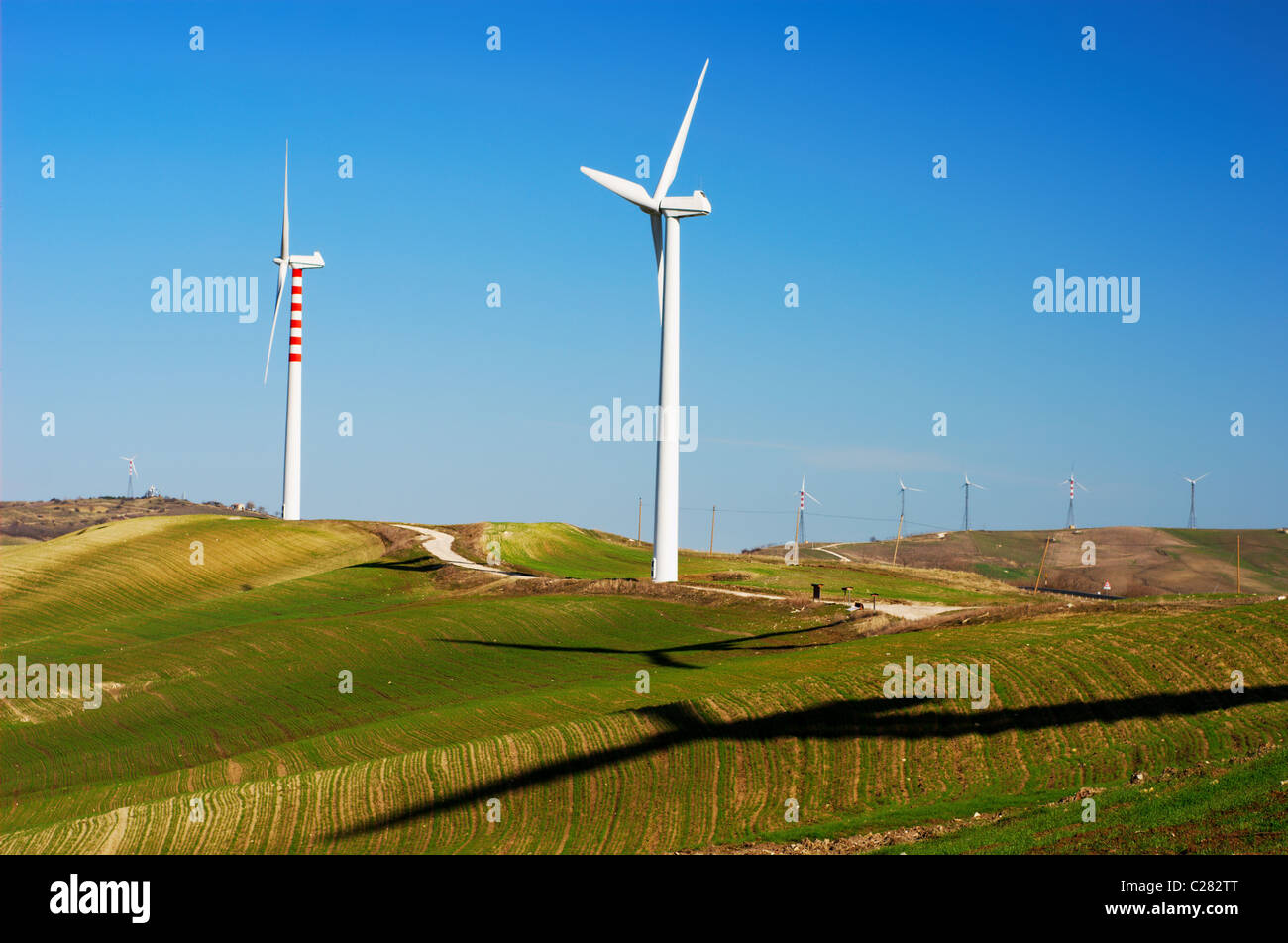 Vertical axis wind turbines and shadows on top of a hill Stock Photo ...