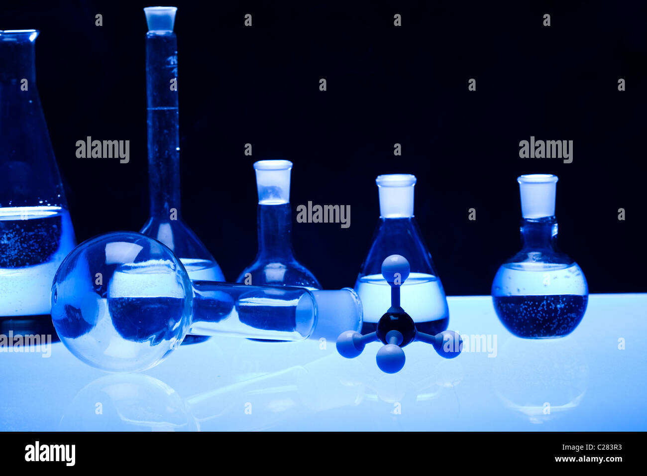 Laboratory glass in blue scenery Stock Photo - Alamy