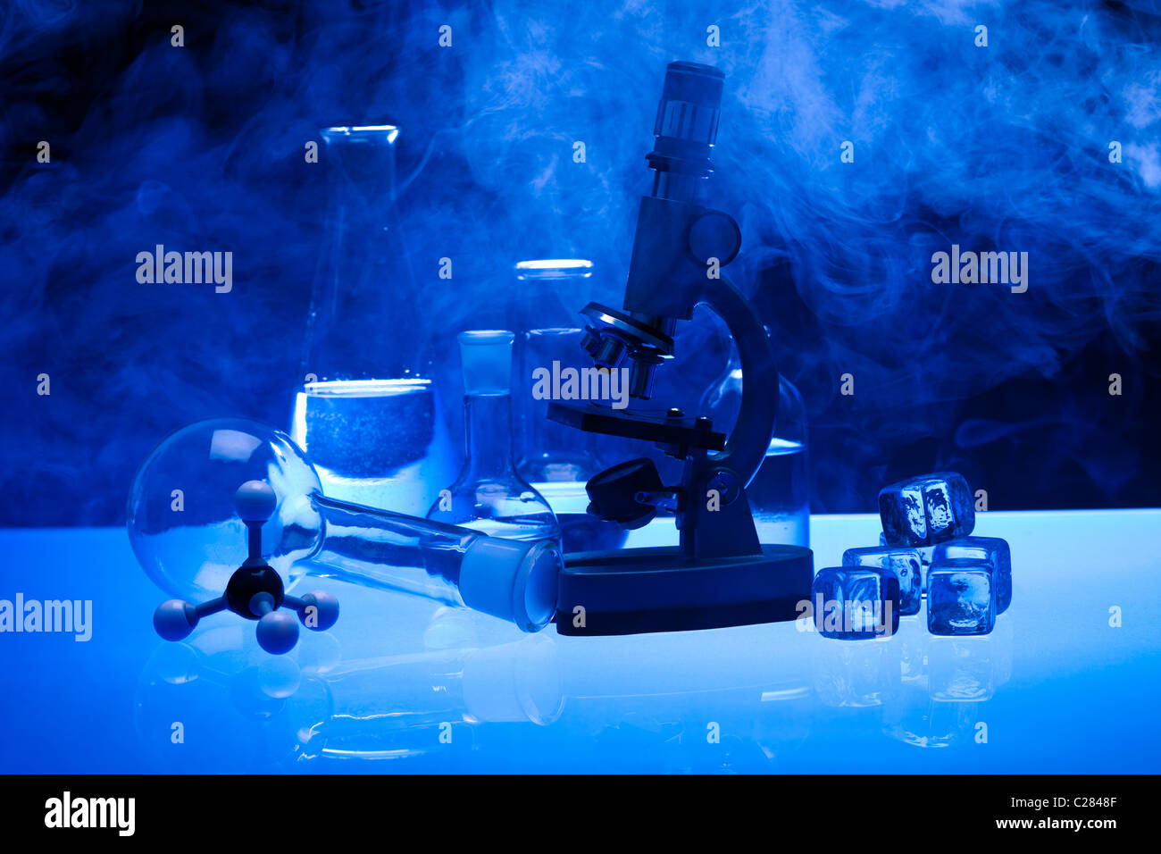 Laboratory glass in blue scenery Stock Photo - Alamy